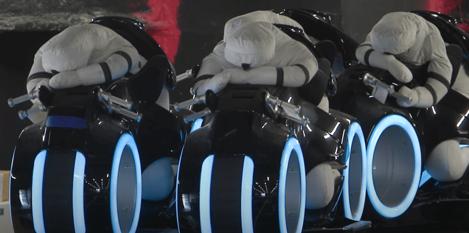 Behind-the-scenes look at ride vehicles and testing for Tron Lightcycle ...