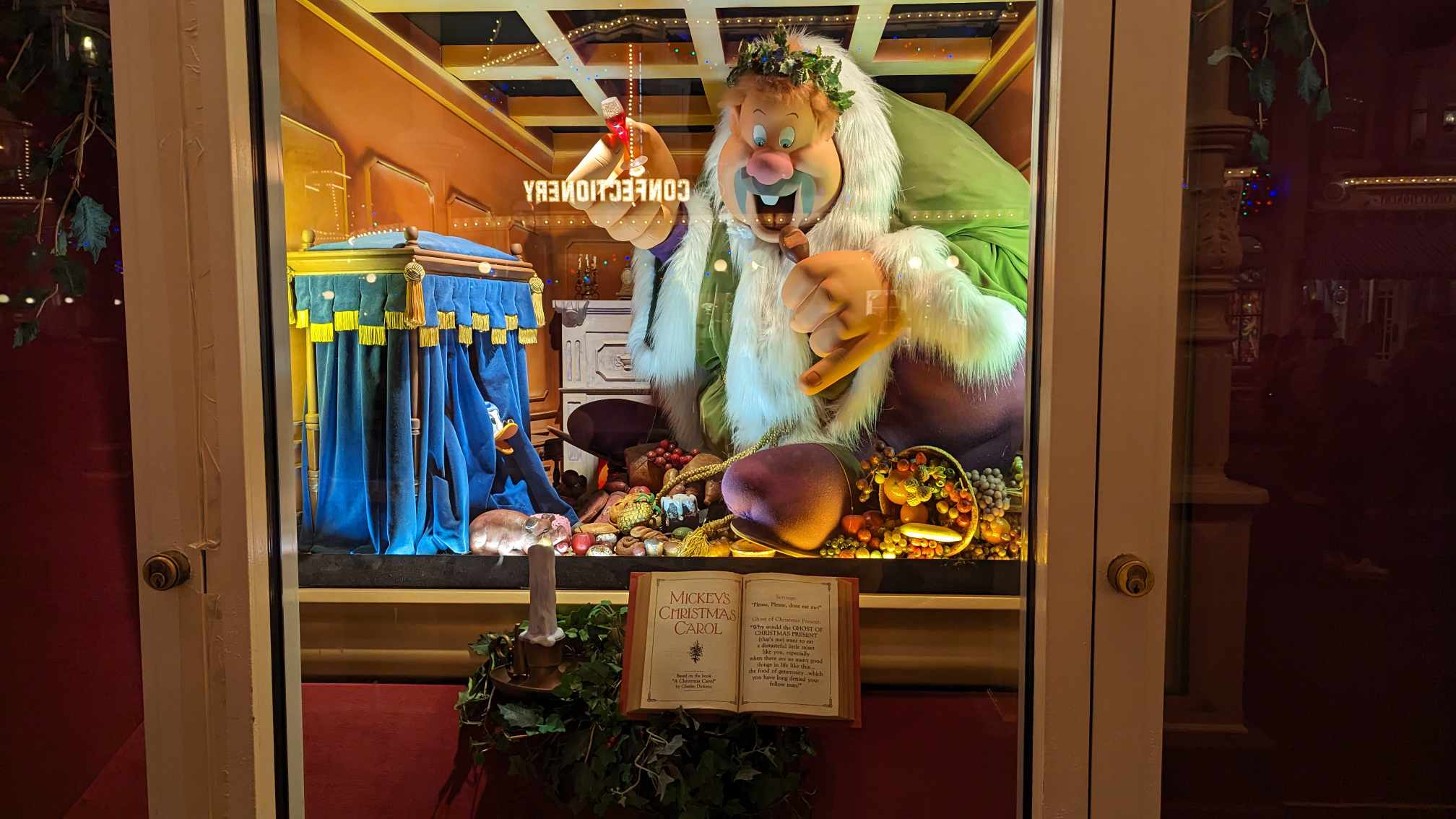 magic-kingdom-main-street-usa-mickey-christmas-carol-window-4