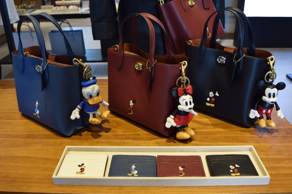 Enchanting Disney Coach Collection Available At Disney Springs! | Chip ...